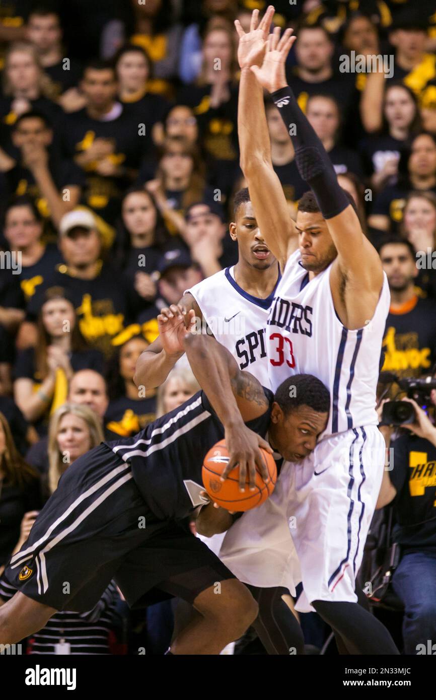VCU guard Treveon Graham, left, collides with Richmond forward Alonzo ...