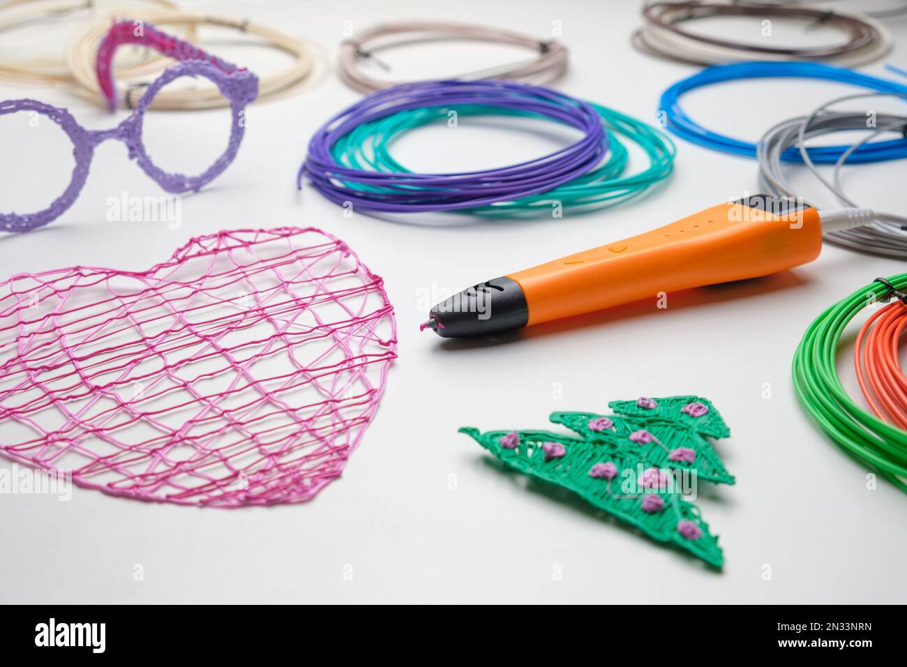 3d Pen. Printing with Colored Plastic Wire Filament. Child making a ...