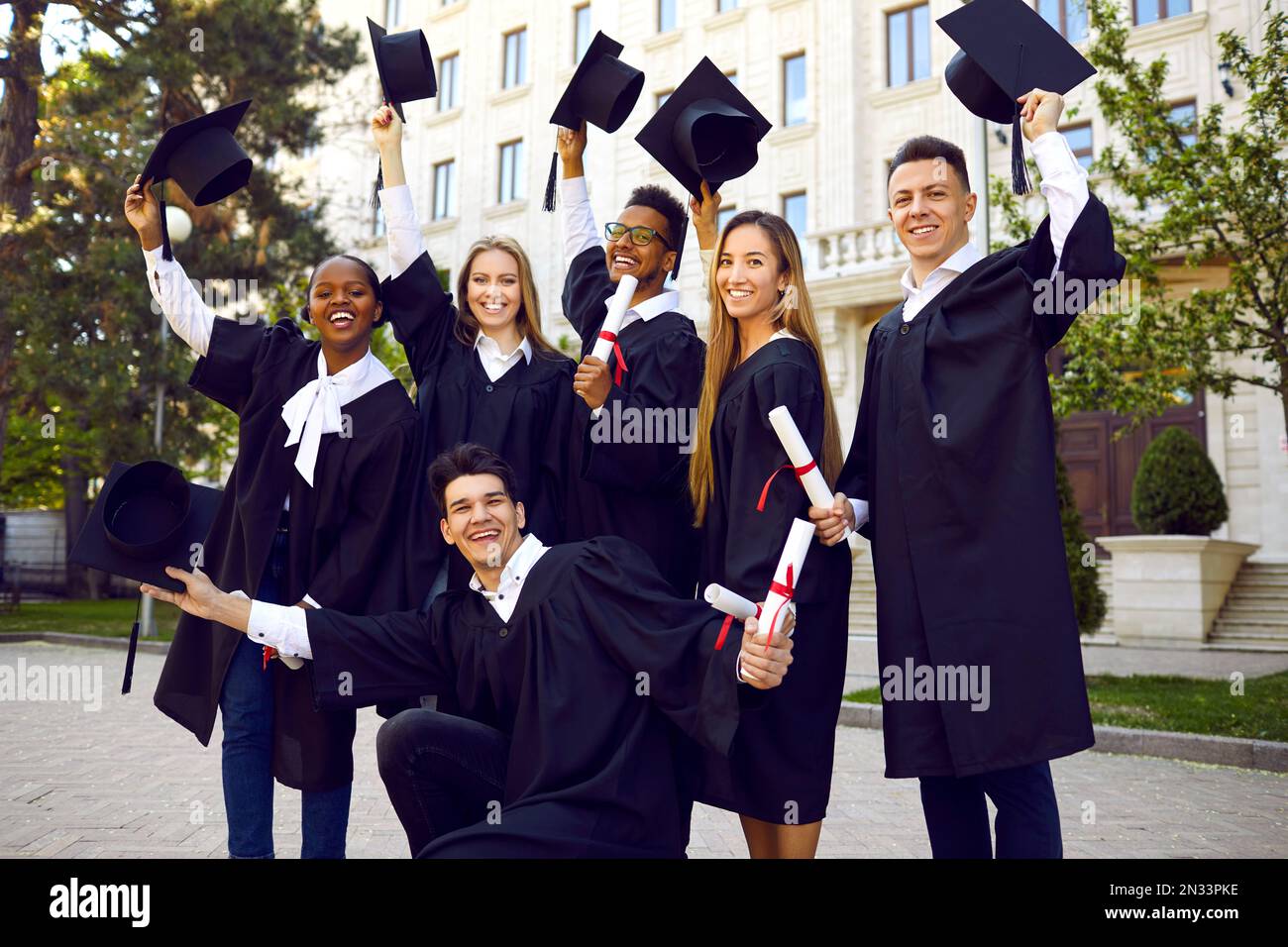 Young multinational people rejoicing students university dressed in ...