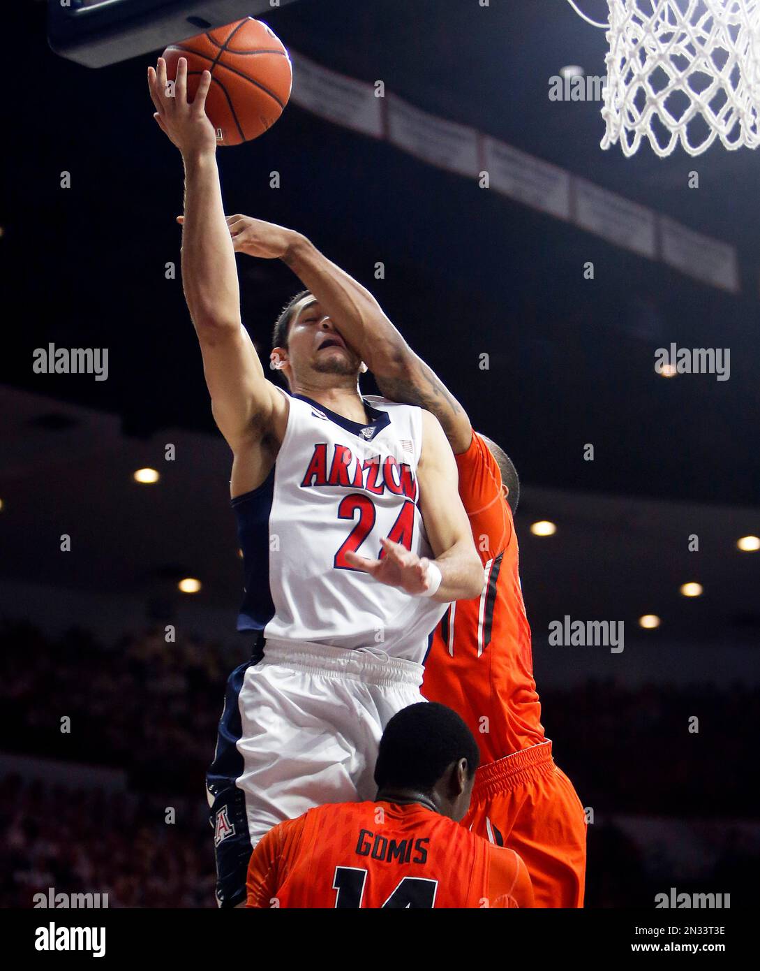 Arizona guard Elliott Pitts (24) gets fouled by Oregon State guard Gary ...