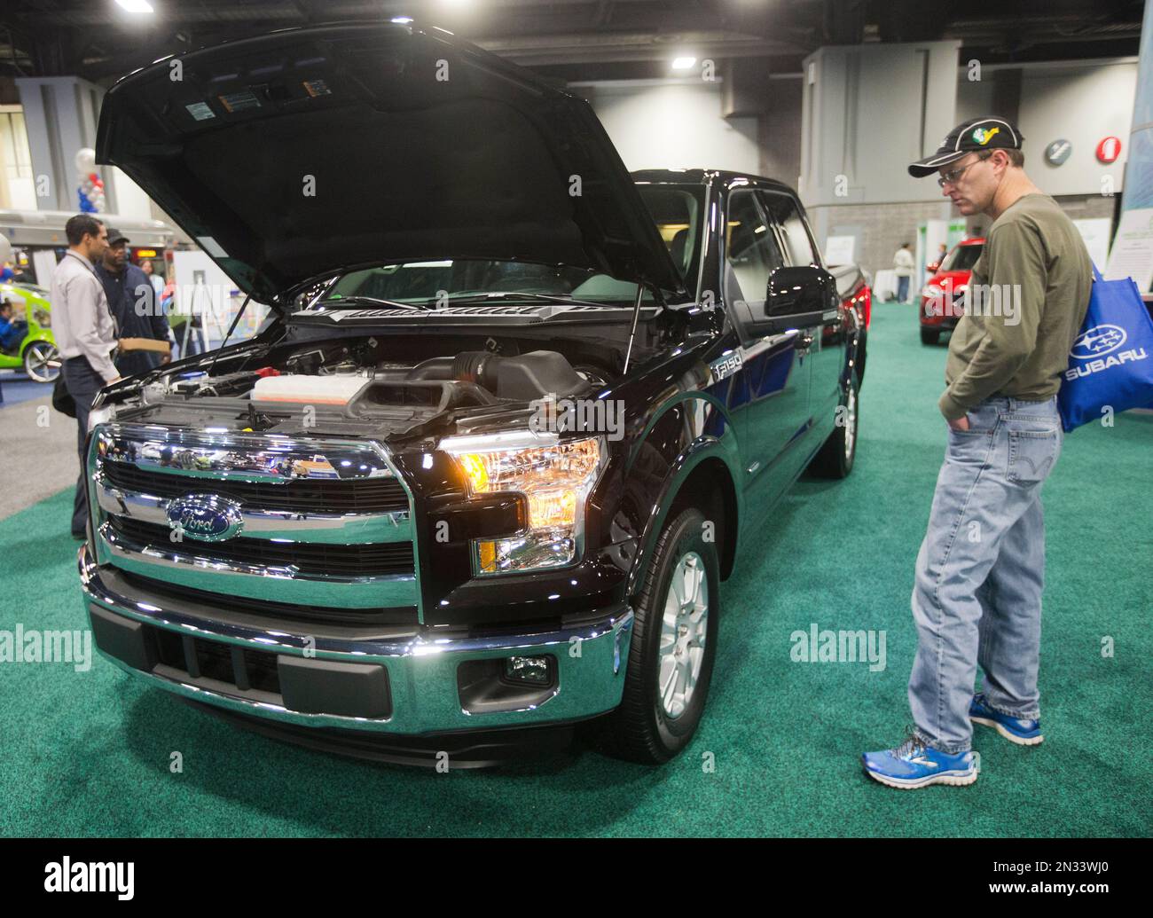 Joshua Marcoe of Greenbelt, Md. looks over a 2015 Ford F-150 pickup ...
