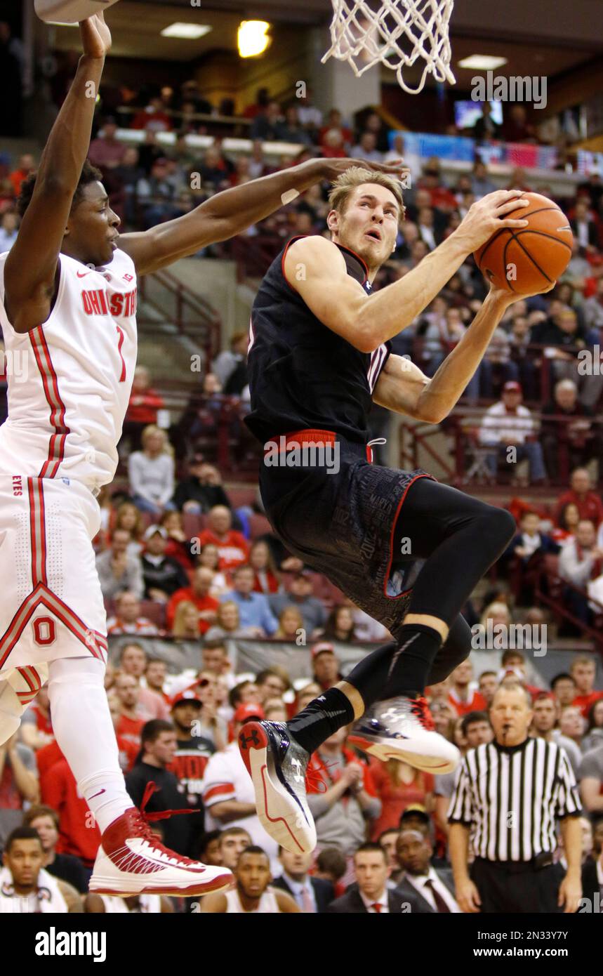 Maryland's Jake Layman, right, goes up for a shot against Ohio State's ...