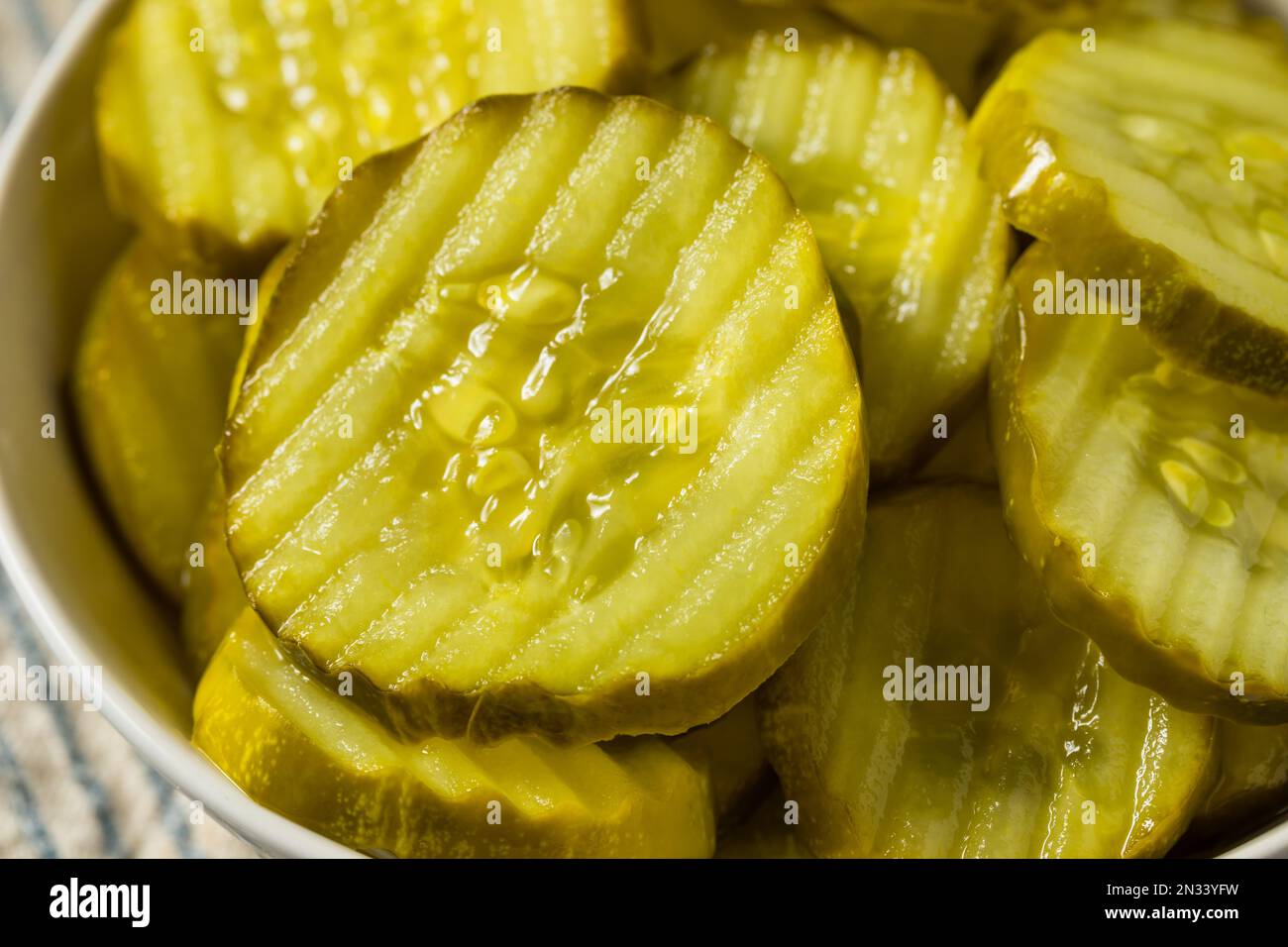 Homemade Preserved Dill PIckle Slices in a Bowl Stock Photo - Alamy