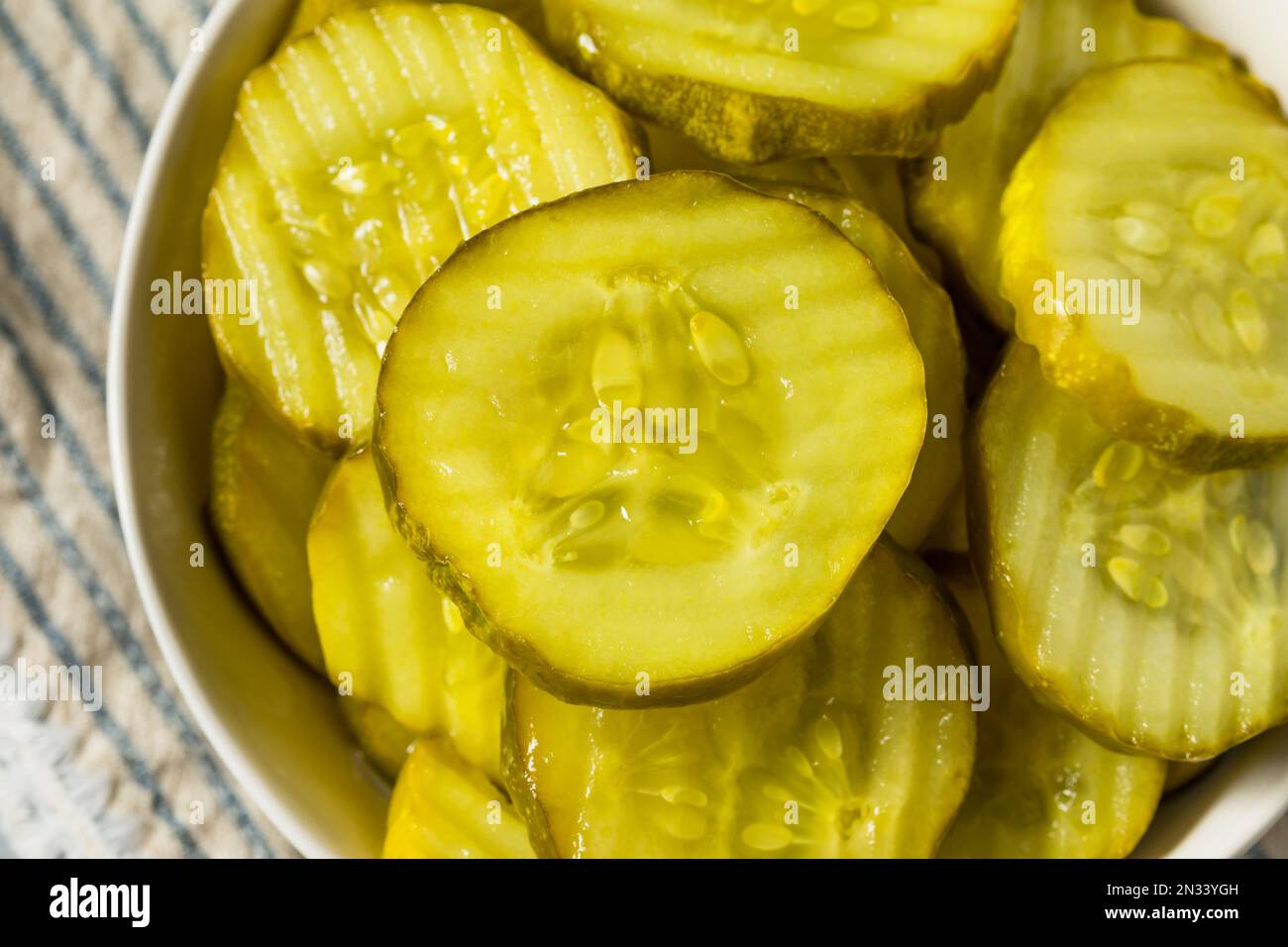 Homemade Preserved Dill PIckle Slices in a Bowl Stock Photo - Alamy