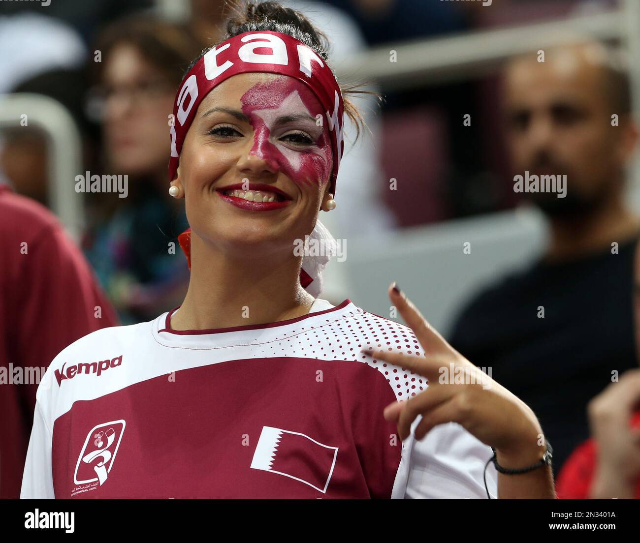 A fan of the Qatar team poses for a picture at the 24th Men's Handball ...