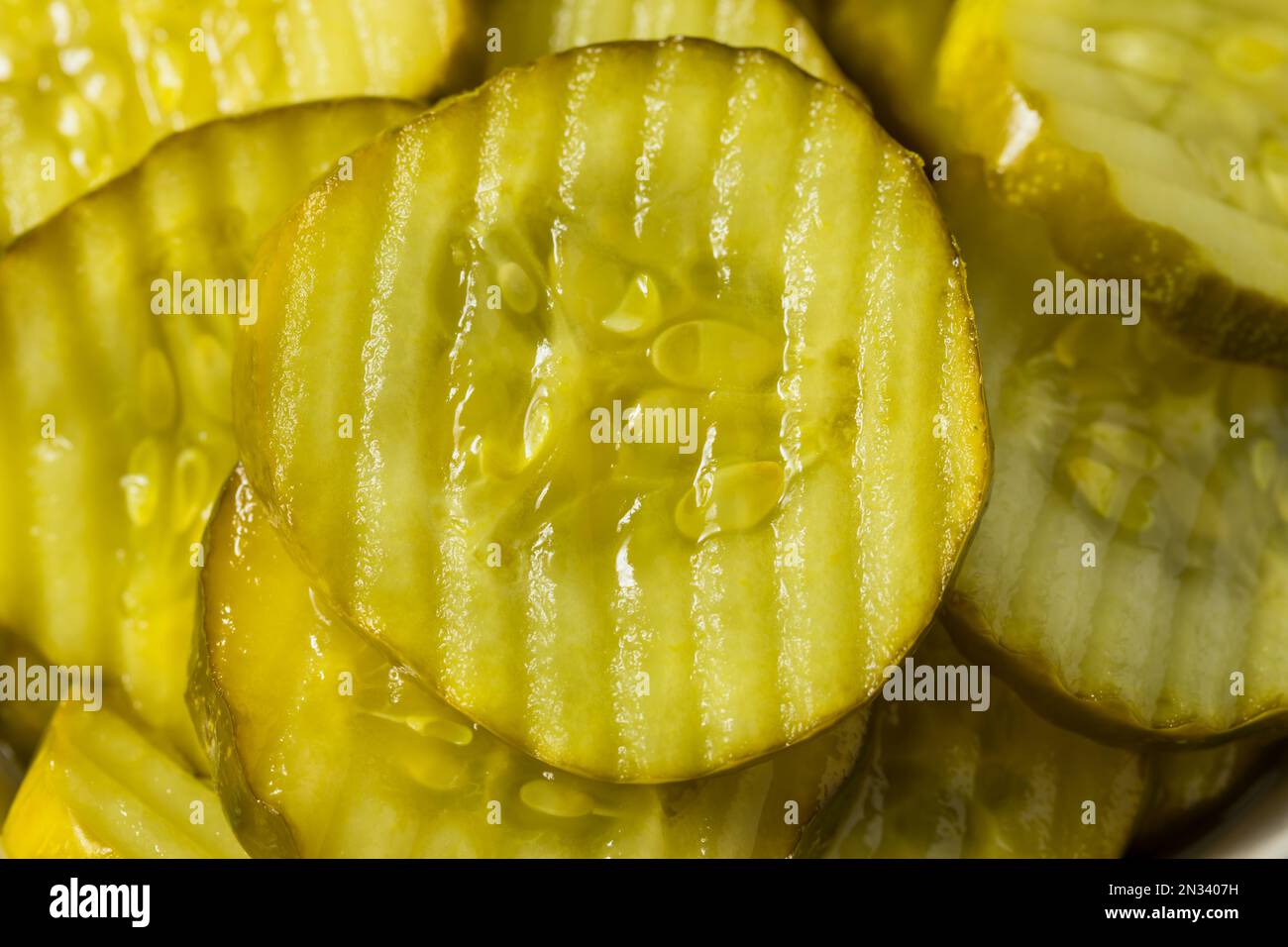 Homemade Preserved Dill PIckle Slices in a Bowl Stock Photo - Alamy