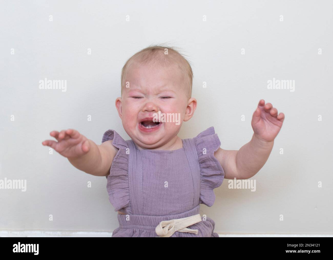 Portrait of crying caucasian baby girl Stock Photo - Alamy