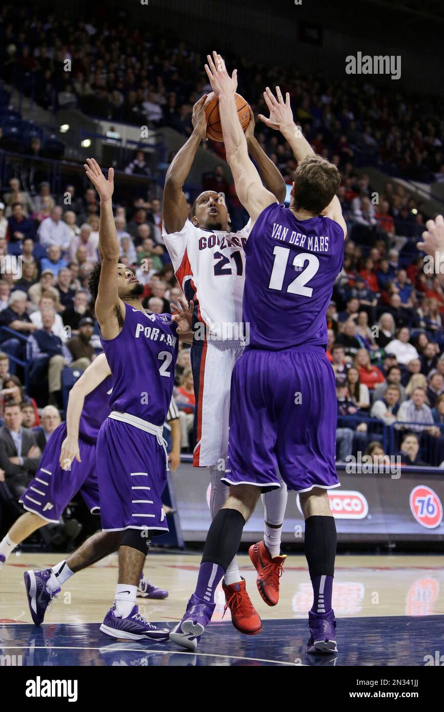 Gonzaga's Eric McClellan (21) shoots between Portland's Alec Wintering ...