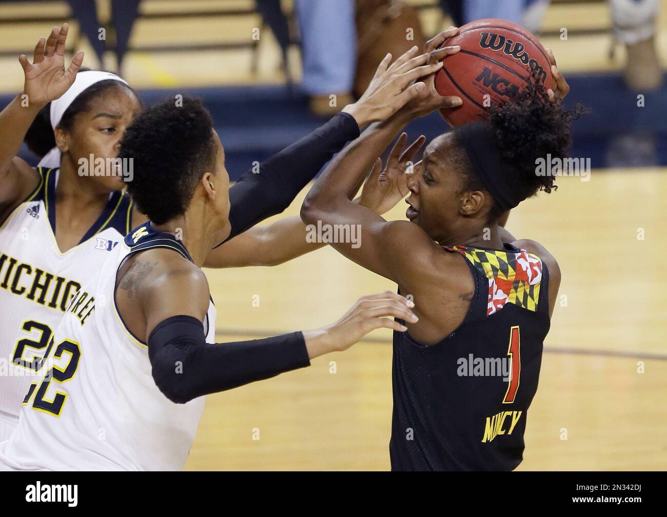 Michigan guard Siera Thompson, left, and forward Cyesha Goree (22 ...