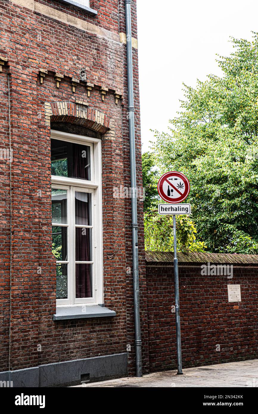 A vertical shot of a sign with crossed out alcohol, drugs, and ...