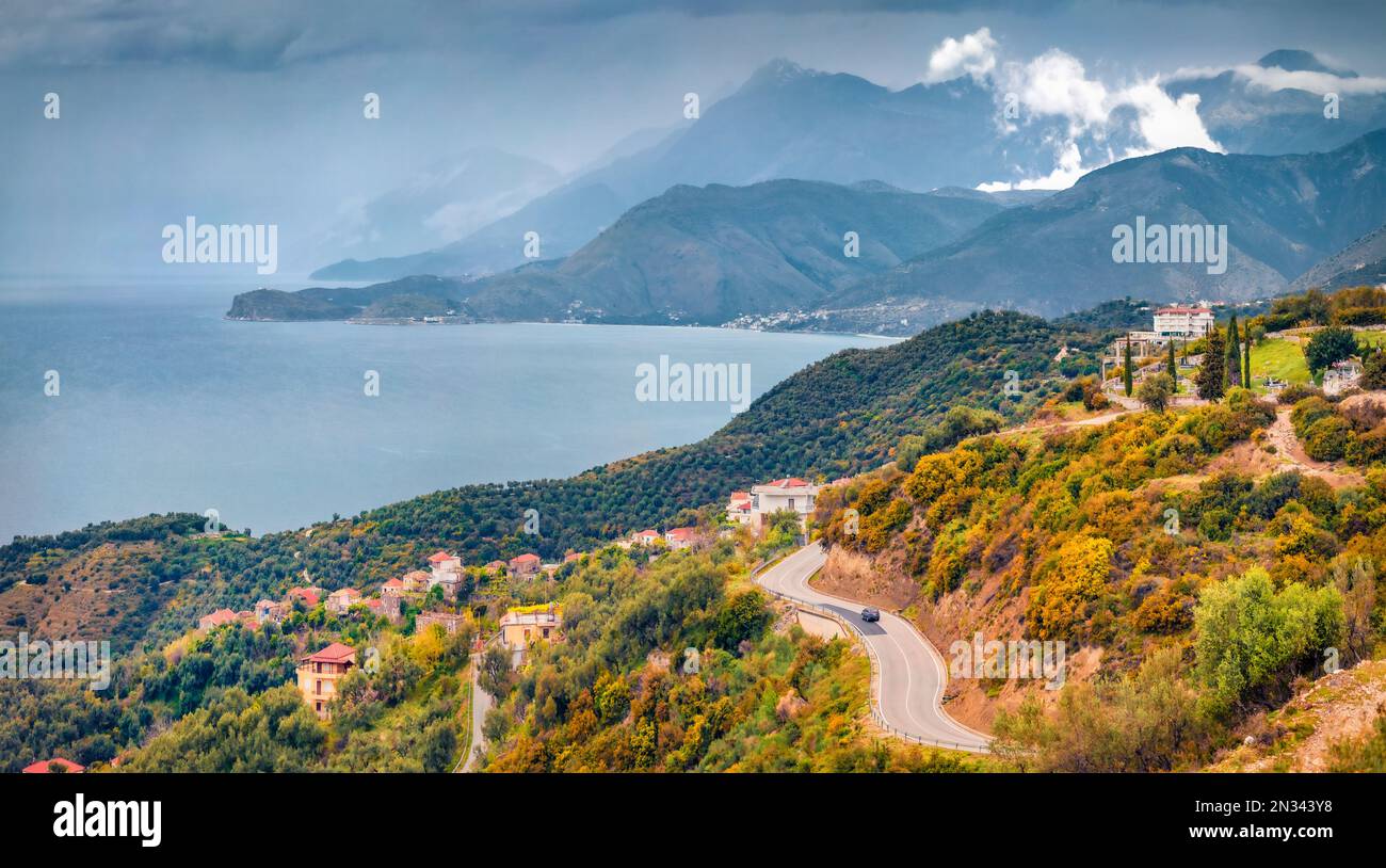 Typical Albanian landscape on the Adriatic shore with asphalt road and ...