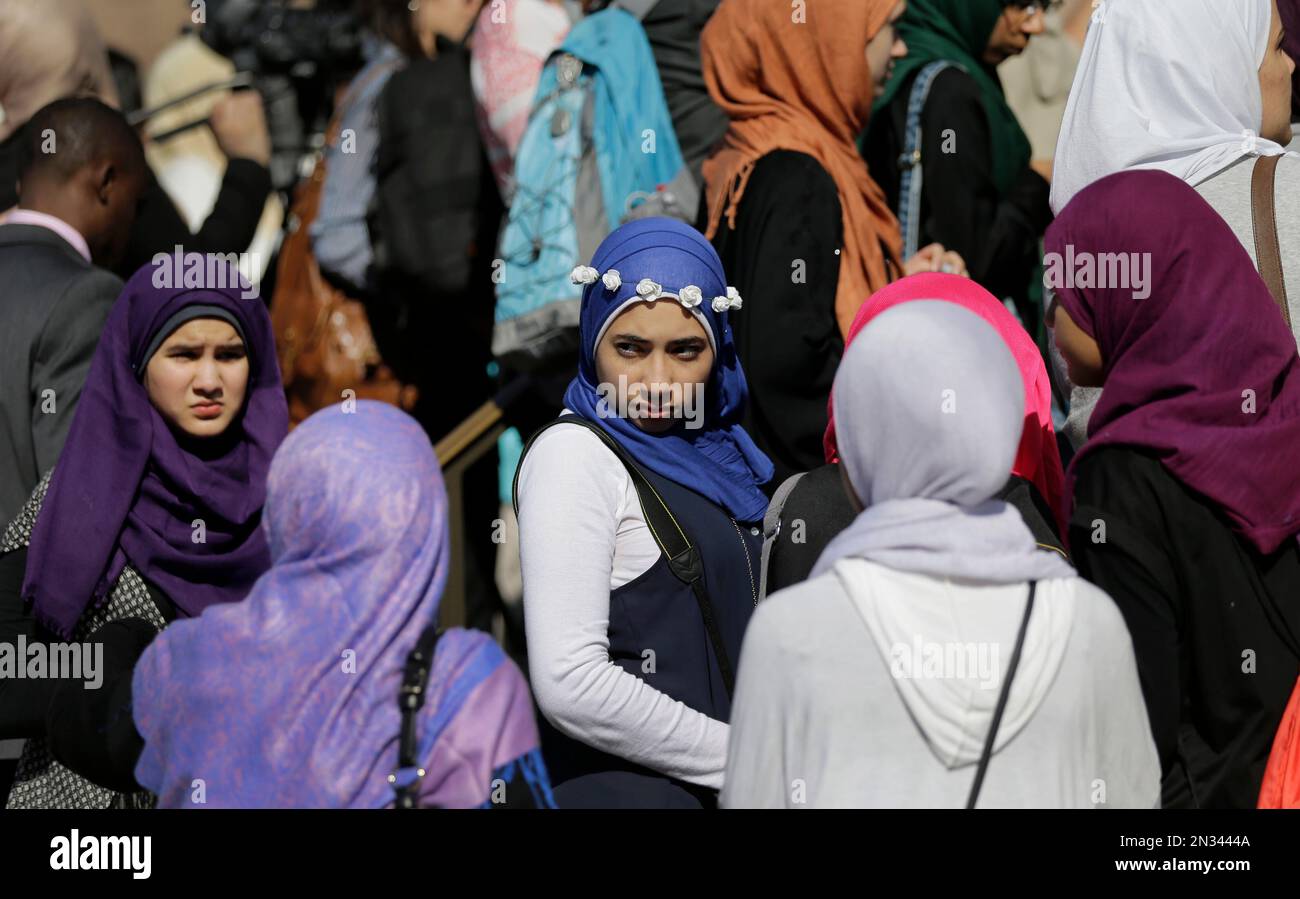 Participants at a Texas Muslim Capitol Day rally look pack a protesters ...