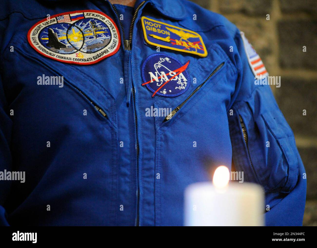 Five-time shuttle astronaut Robert "Hoot" Gibson stands near a candle honoring fallen astronauts ...