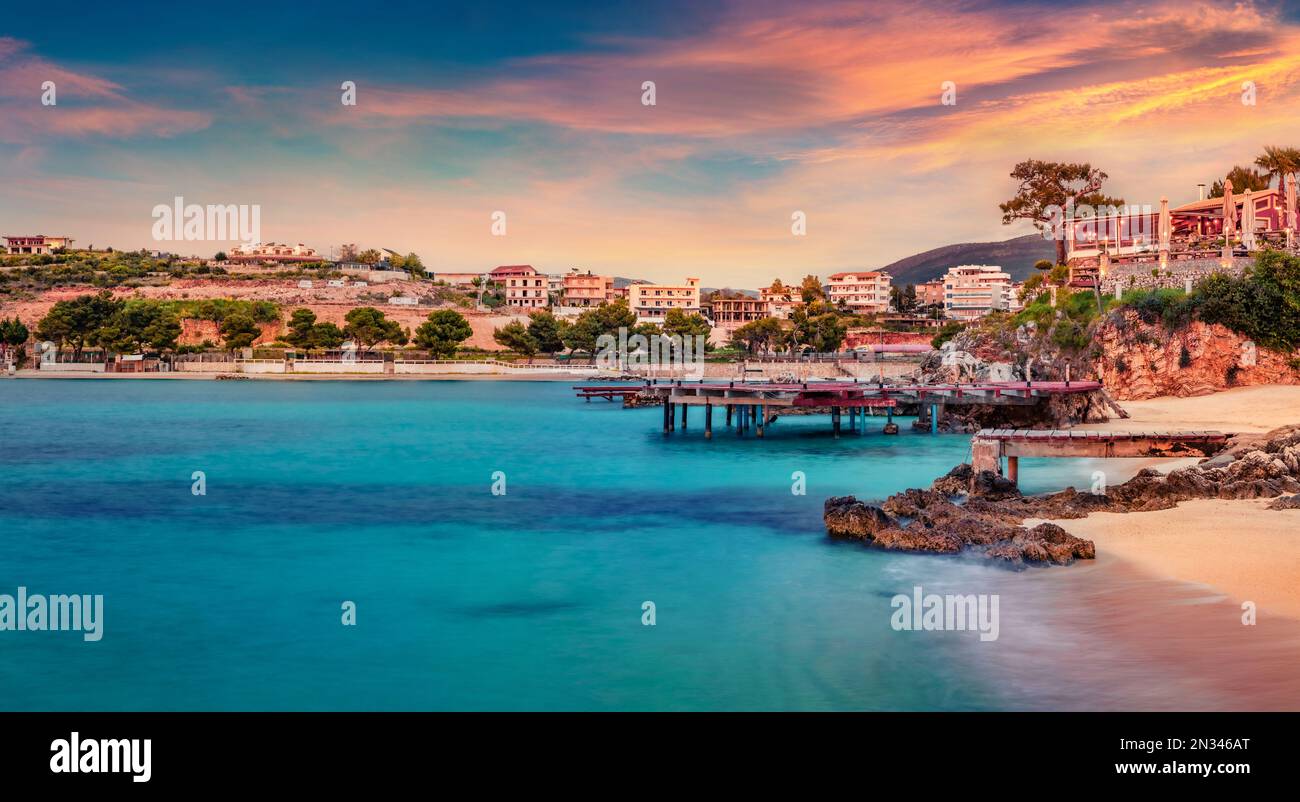 Colorful spring sunset in Ksamil town. Amazing evening seascape if ...