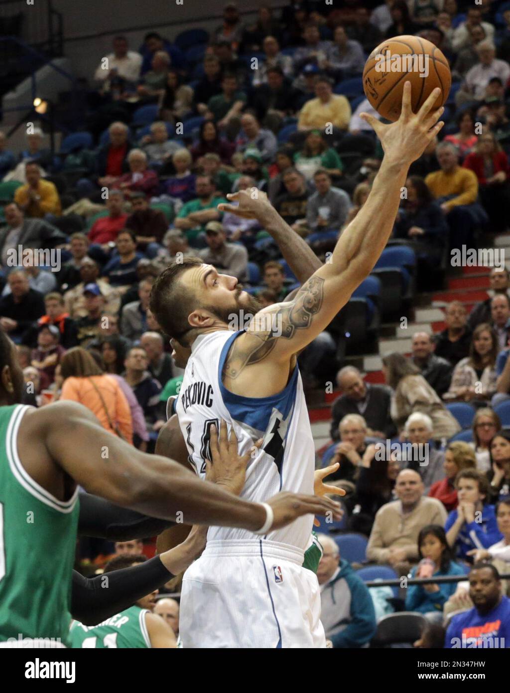 Minnesota Timberwolves’ Nikola Pekovic of Montenegro pulls in a rebound ...