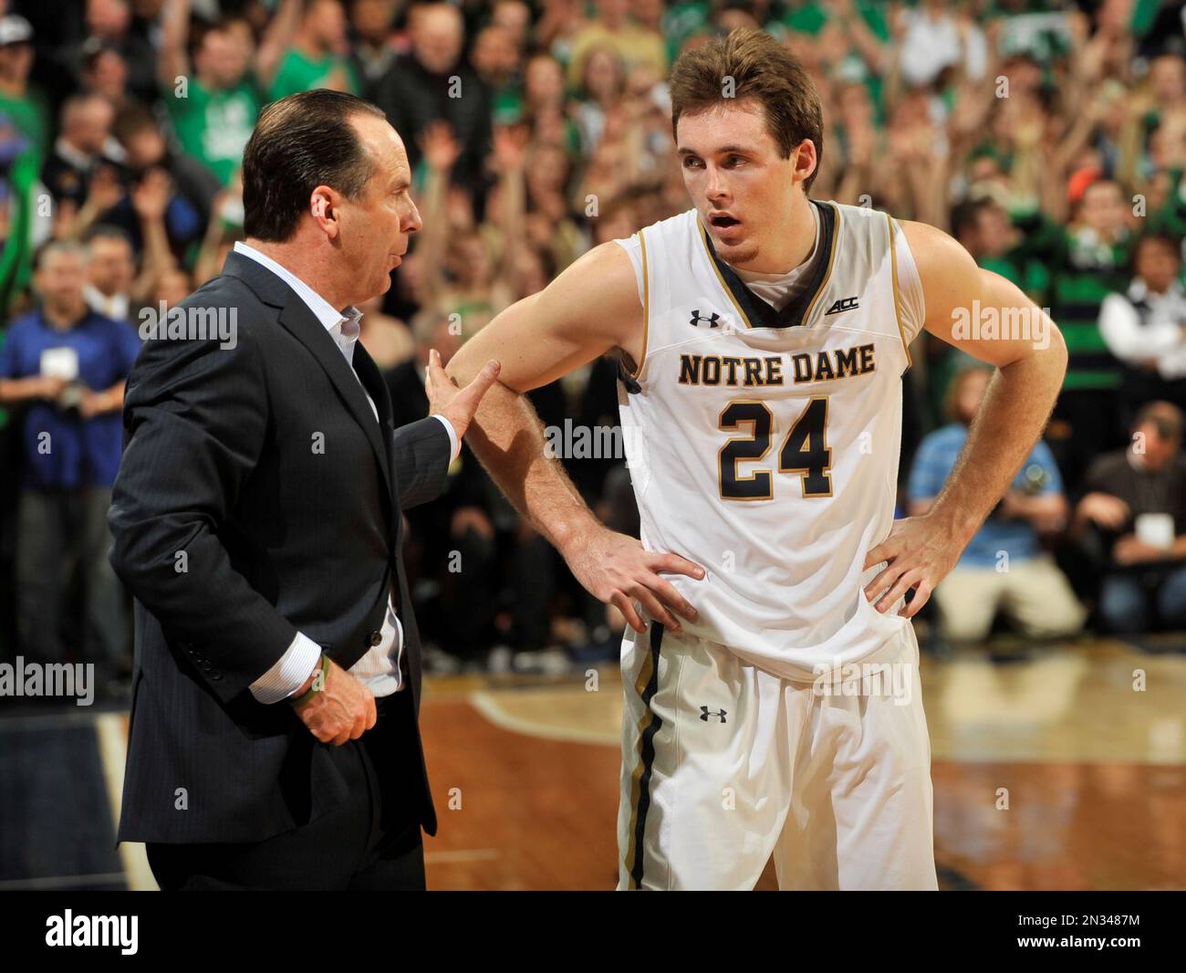 Notre Dame guard Pat Connaughton, rght, talks with coach Mike Brey in ...