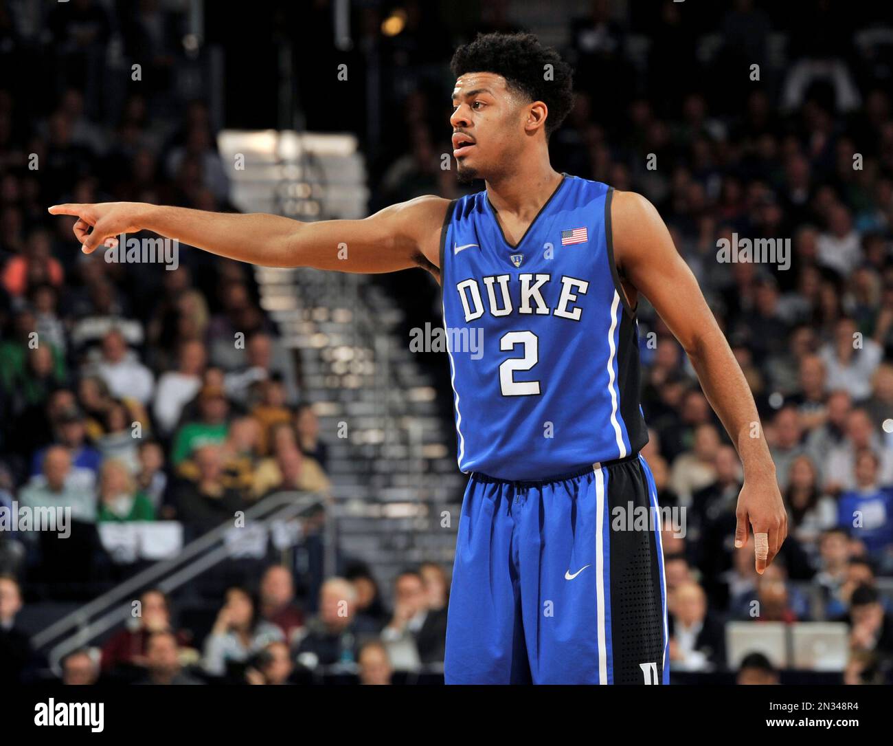 Duke guard Quinn Cook points in the second half of an NCAA college ...