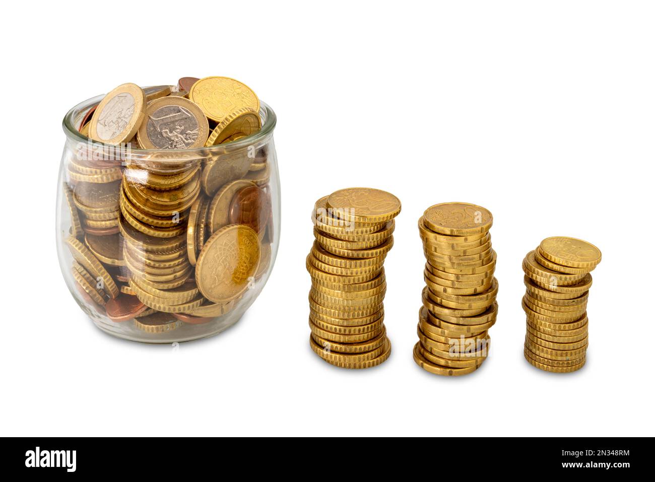Stack of gold-colored cent coins next to glass cup full of euro coins ...
