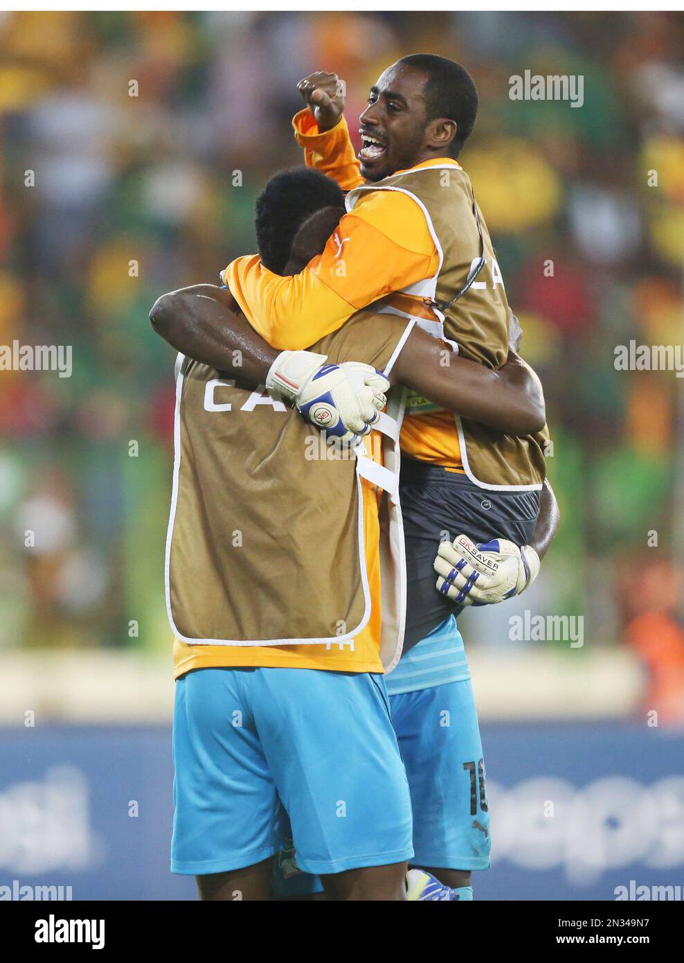 Ivory Coast's goalkeeper, Boubakar Barry, top, celebrates after their ...