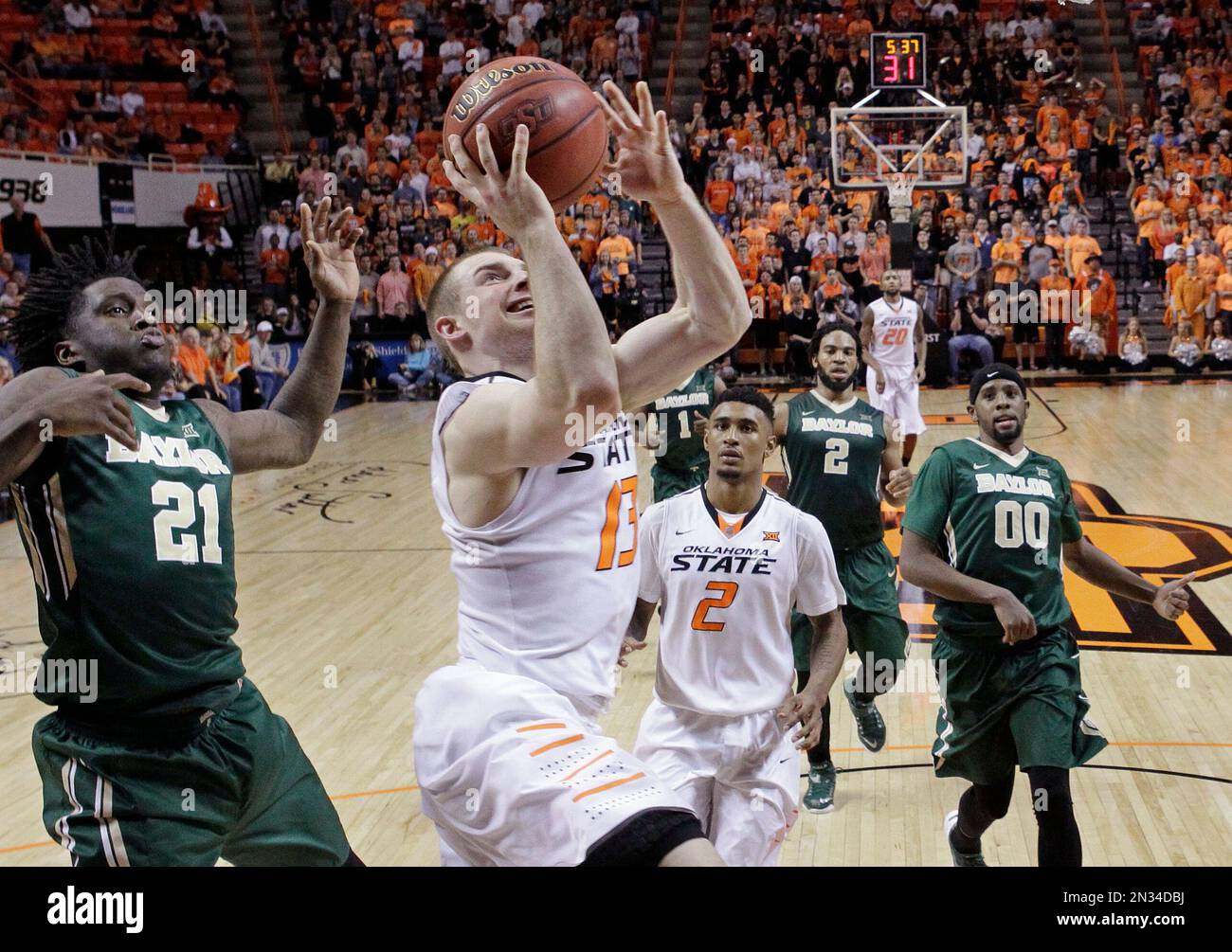 Oklahoma State guard Phil Forte (13) shoots in front of Baylor forward ...