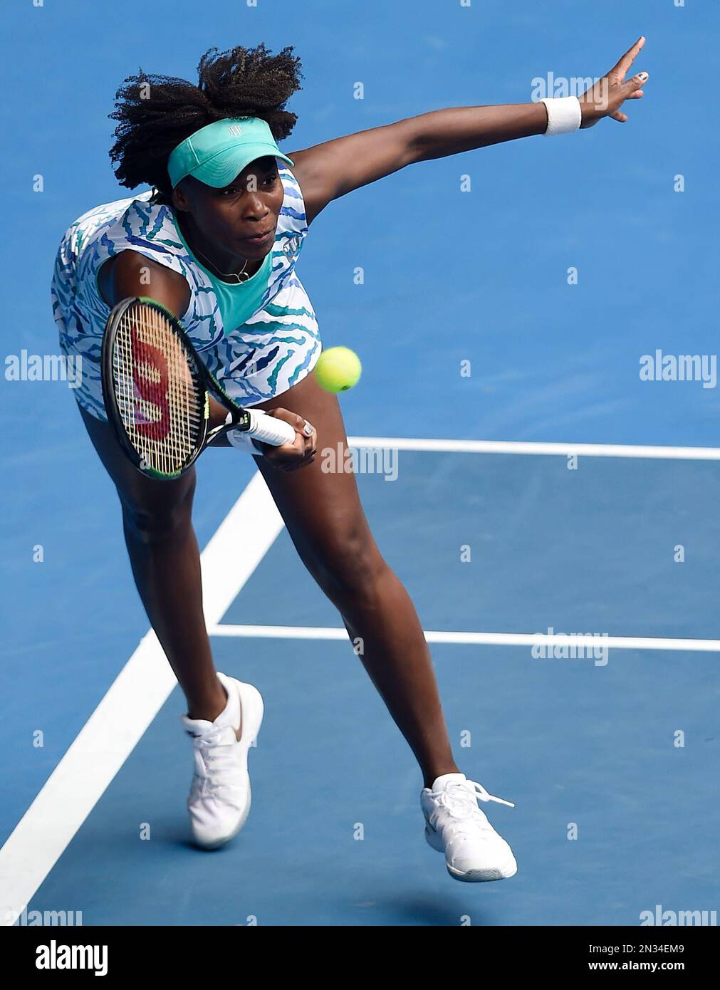Venus Williams of the U.S. makes a forehand return to compatriot ...