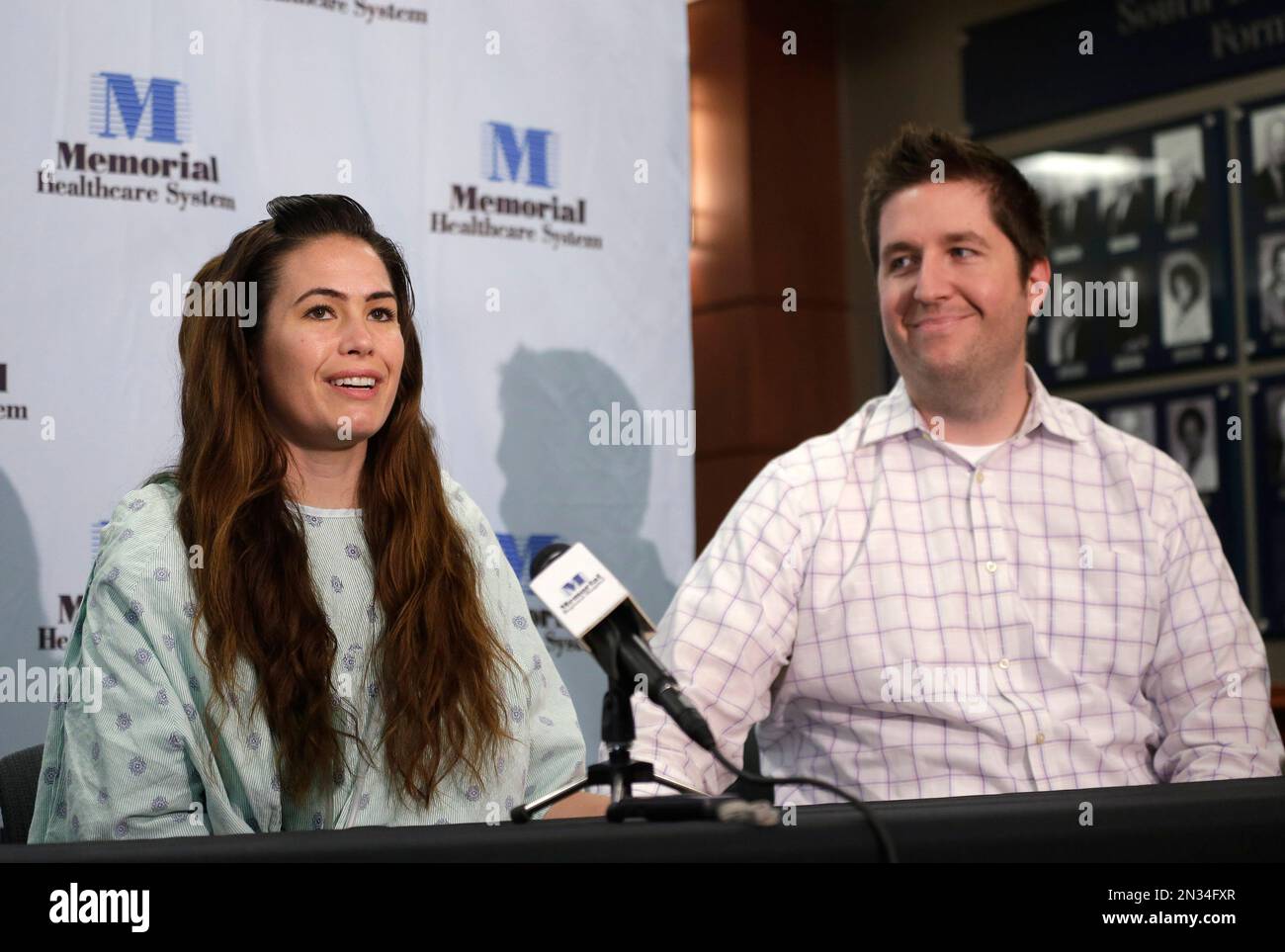 Britt Martin, right, of Dallas, smiles a he listens to his wife Lacy ...