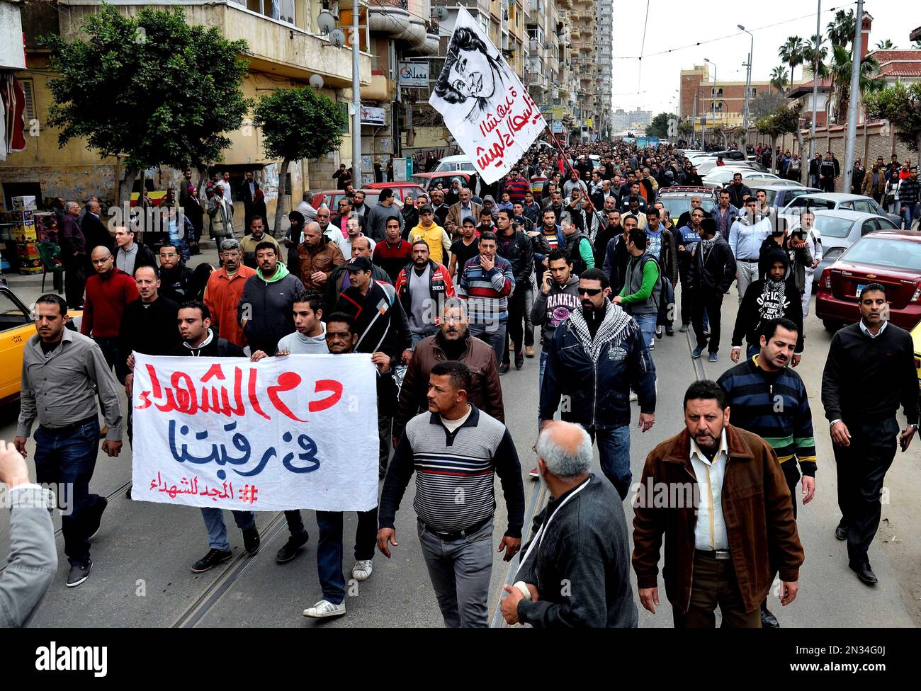 FILE - In this Sunday, Jan. 25, 2015 file photo Egyptians march during ...