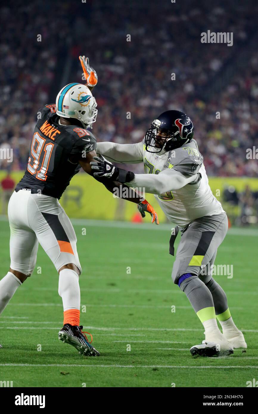 Team Carter's Duane Brown #76 in action, blocking Team Irvin's Cameron ...