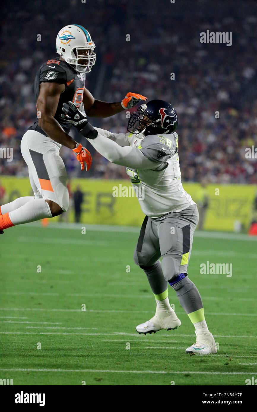 Team Carter's Duane Brown #76 in action, blocking Team Irvin's Cameron ...