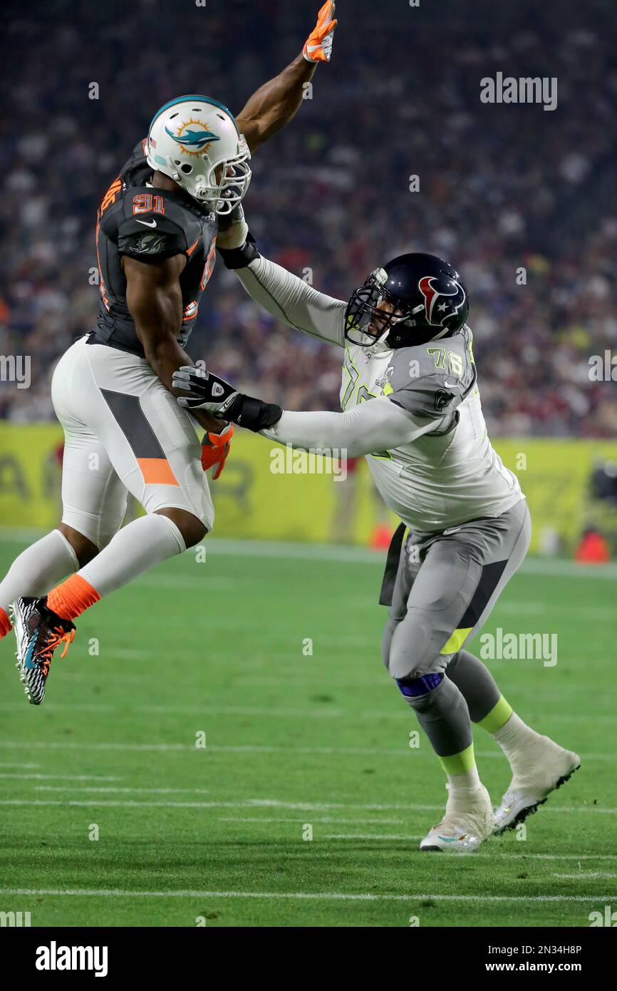 Team Carter's Duane Brown #76 in action, blocking Team Irvin's Cameron ...