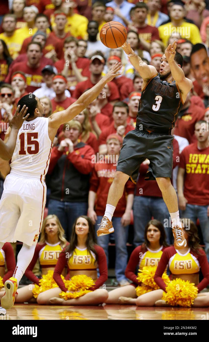 Texas guard Javan Felix passes over Iowa State guard Naz Long, left ...