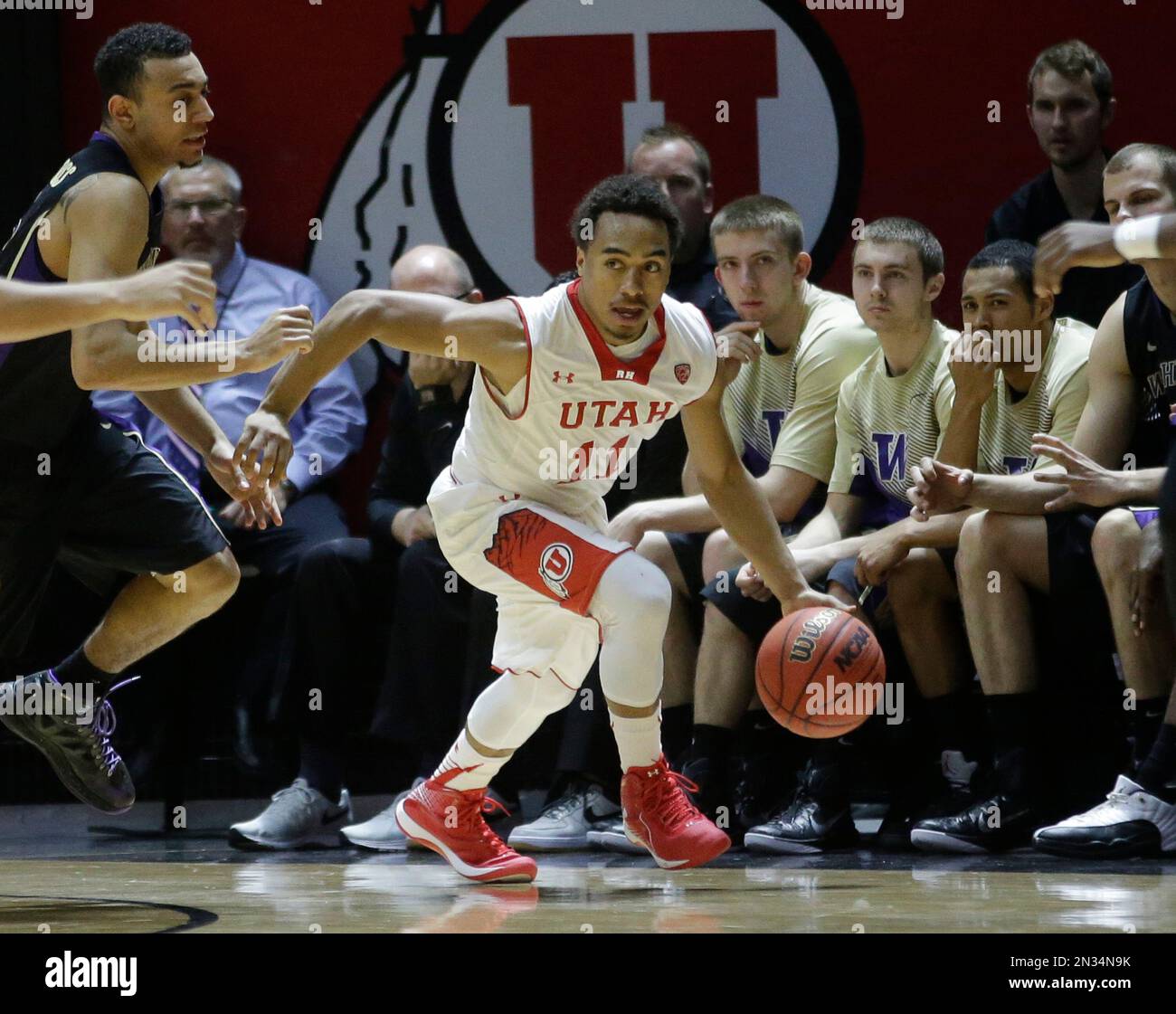 Utah guard Brandon Taylor (11) drives up court in the second half ...