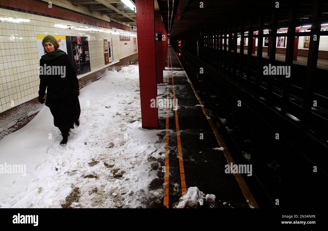 FILE - In this Feb. 17, 2003 file photo, a woman walks through snow ...