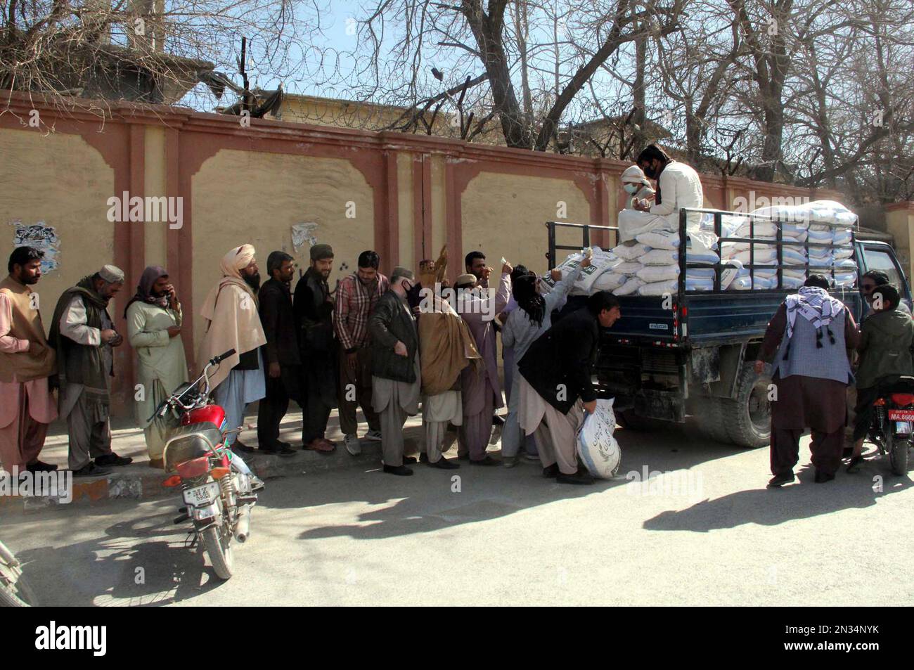 Karachi, Pakistan, February 07, 2023. People gather for buying flour ...