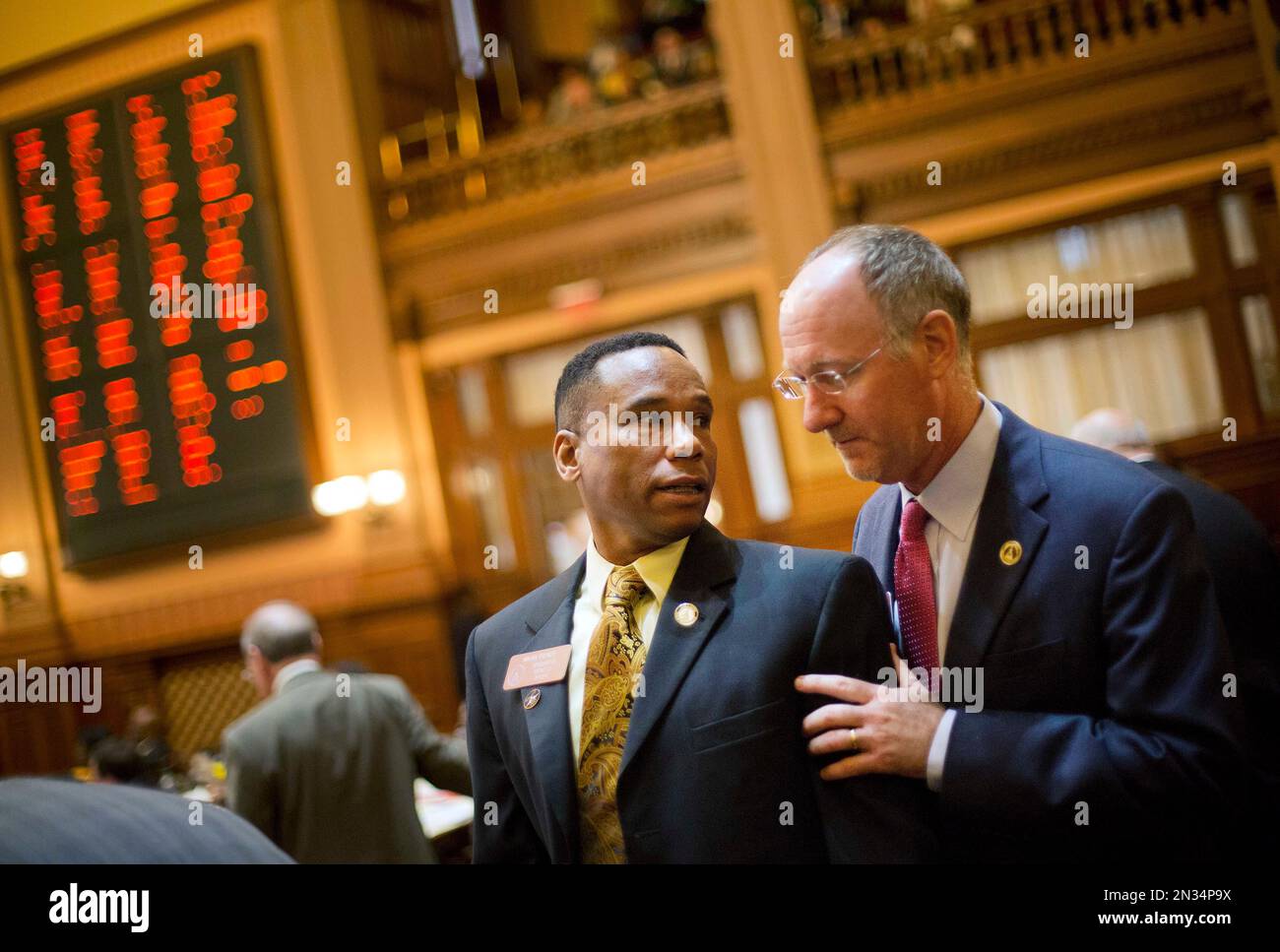 State Rep. Allen Peake, R-Macon, right, talks with Rep. Brian Prince, D ...
