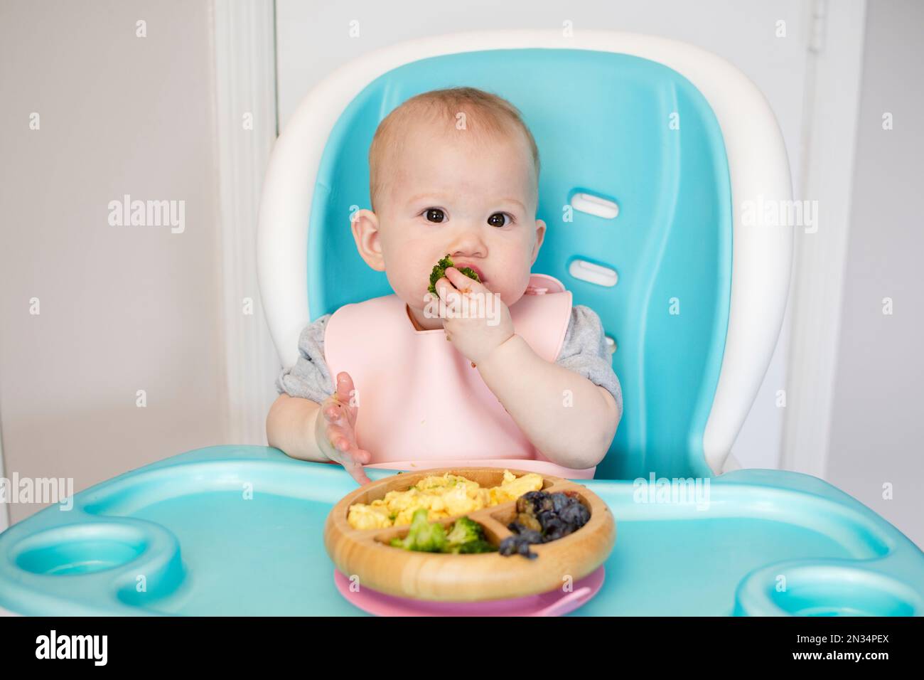 Baby eating broccoli. Baby-led weaning. Weaning. Healthy eating ...