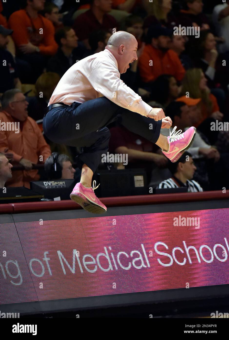 Virginia Tech's head coach Buzz Williams jumps after his team scored a ...