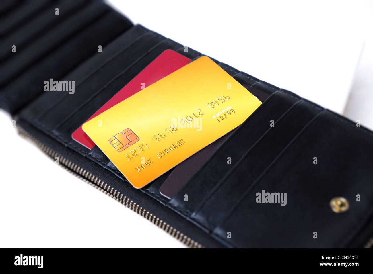 Credit card in black leather wallet on white background, Selective ...