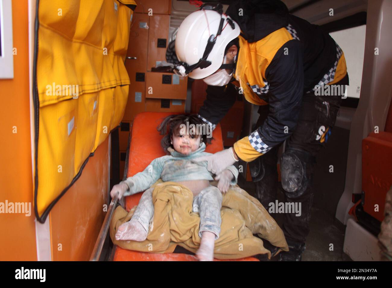 Syrian man carries child hi-res stock photography and images - Alamy