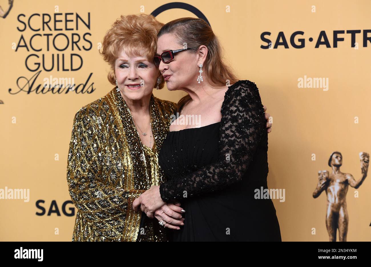 Debbie Reynolds, winner of the Screen Actors Guild lifetime award, left ...