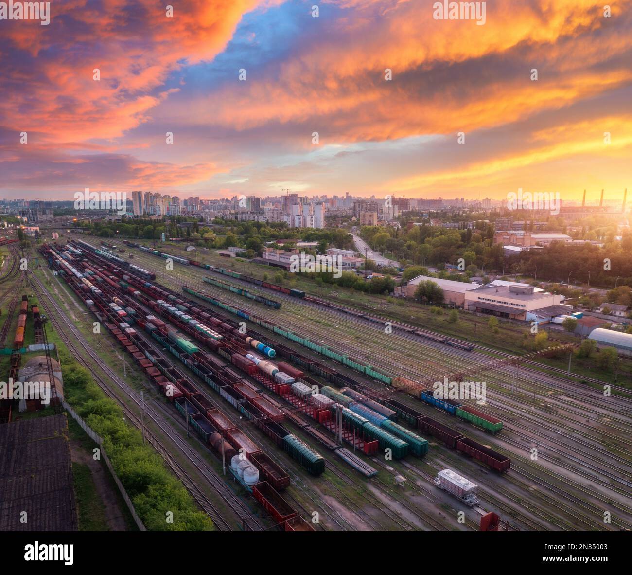 Aerial view of freight trains at sunset. Railway cargo wagons Stock ...