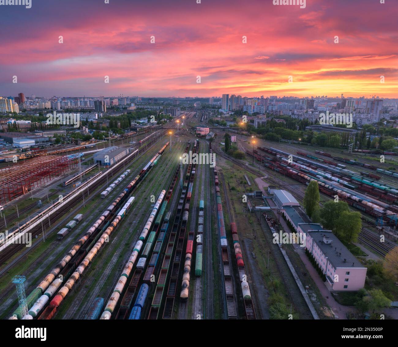 Aerial view of freight trains at colorful sunset. Railway station Stock ...