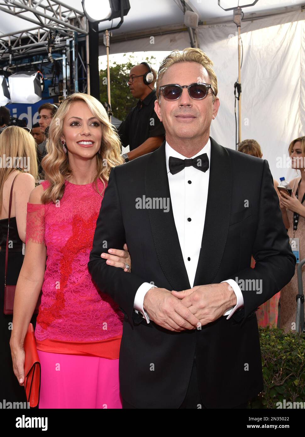 Christine Baumgartner, left, and Kevin Costner arrive at the 21st ...