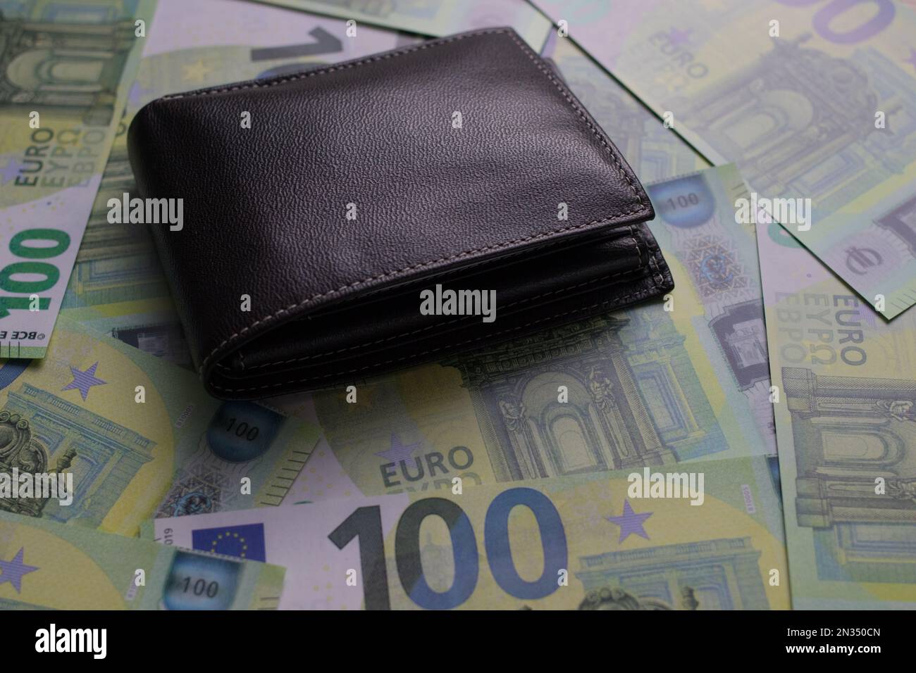 black wallet is on euro banknotes Stock Photo - Alamy