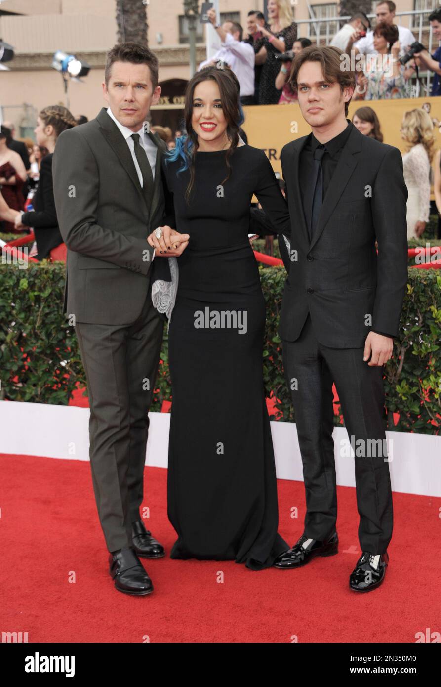 Ethan Hawke, from left, Lorelei Linklater, and Ellar Coltrane arrive at ...