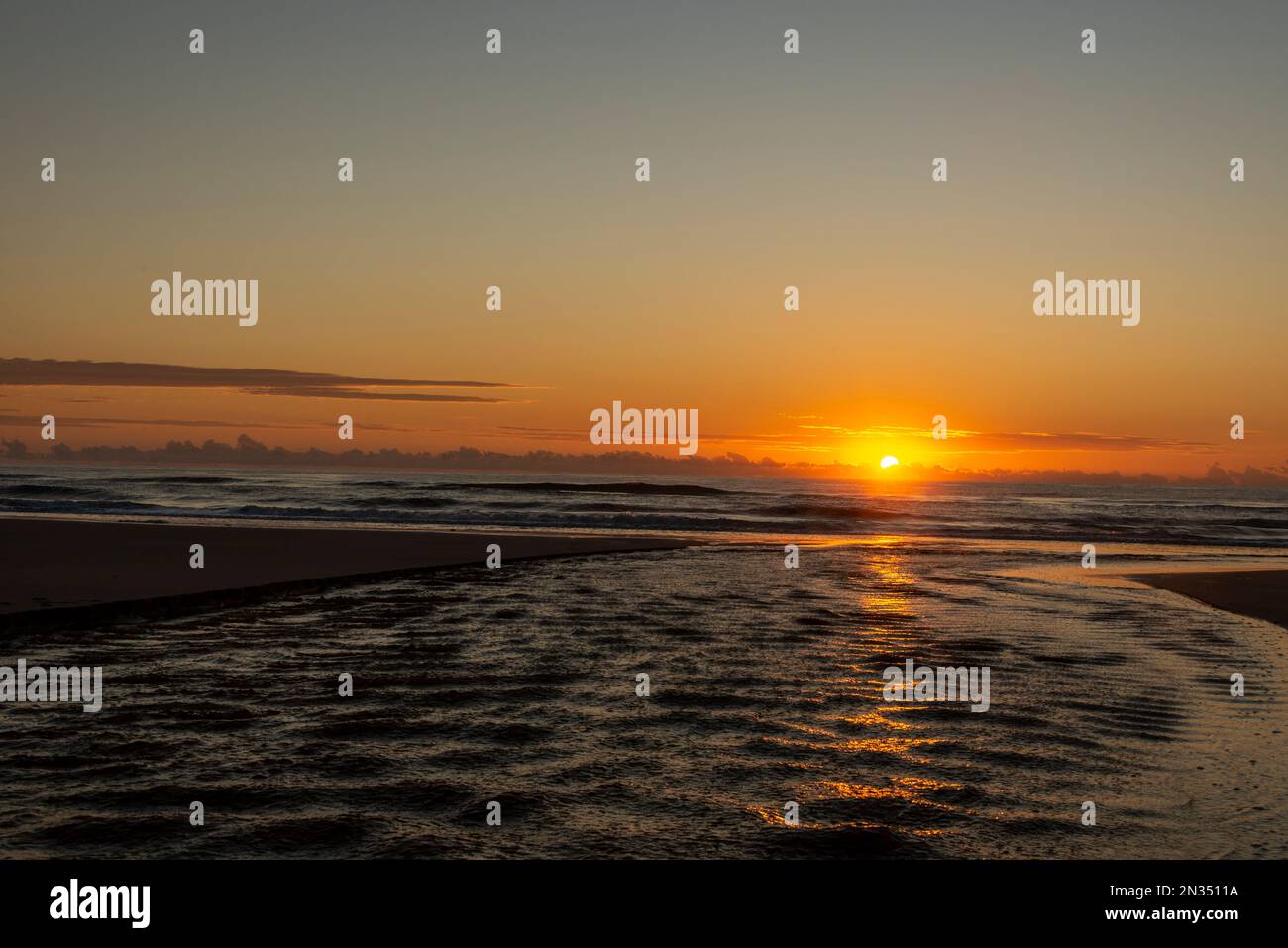 Sunrise at 5am over the Pacific Ocean at Peregian Beach, a beach and ...