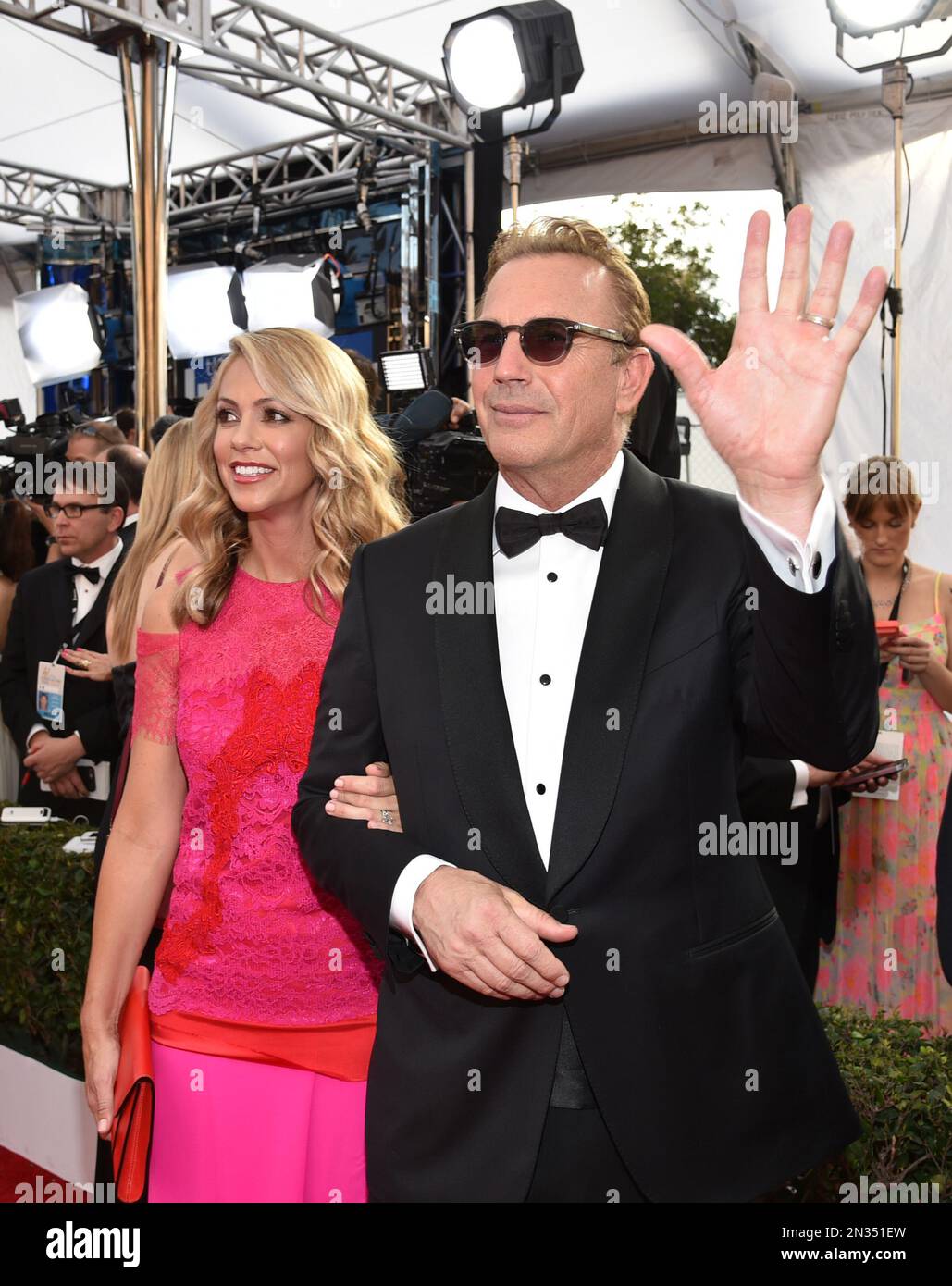 Christine Baumgartner, left, and Kevin Costner arrive at the 21st ...
