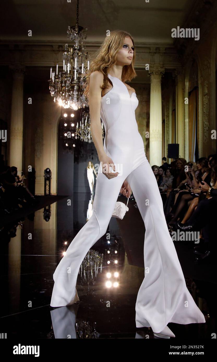 A model presents a creation by Italian fashion designer Donatella ...