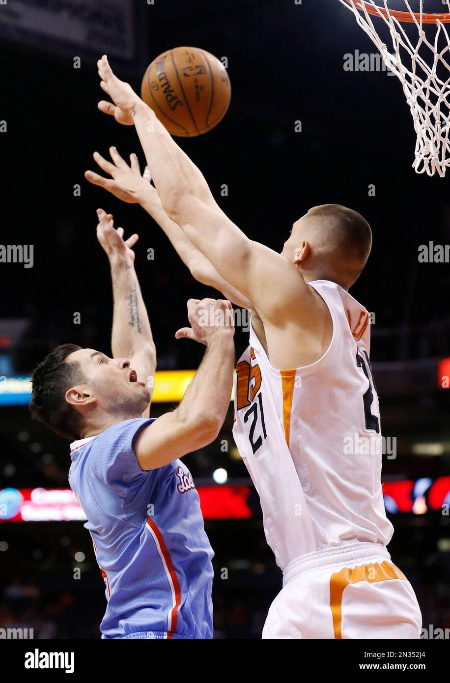 Los Angeles Clippers' J.J. Redick, left, has his shot blocked by ...
