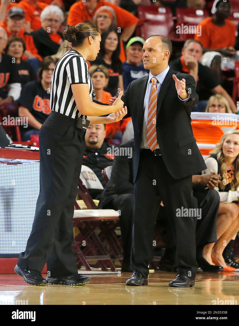 Oregon State head coach Scott Rueck talks to an official against ...